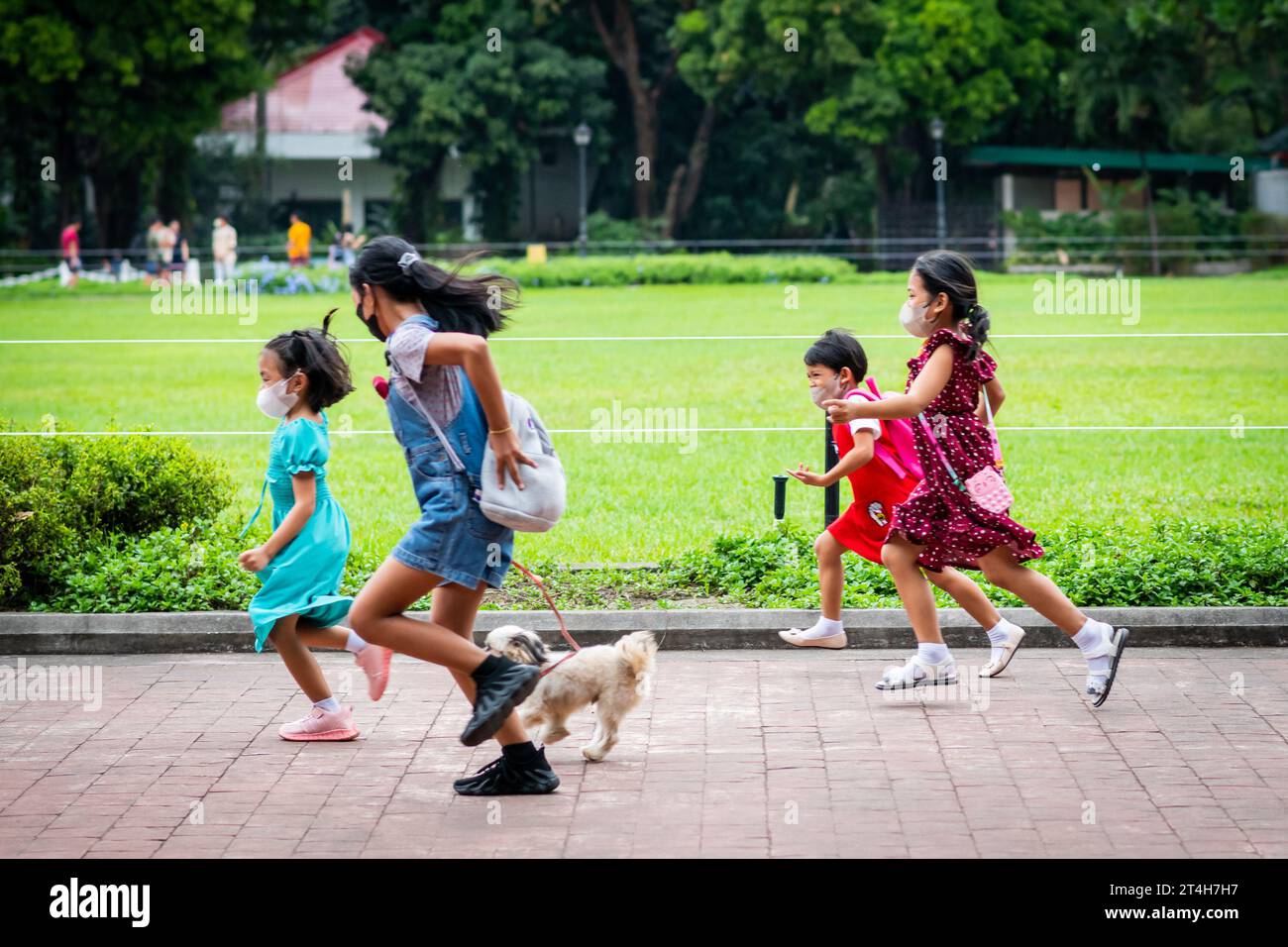 Children at play running through Rizal Park, Ermita, Manila, The ...