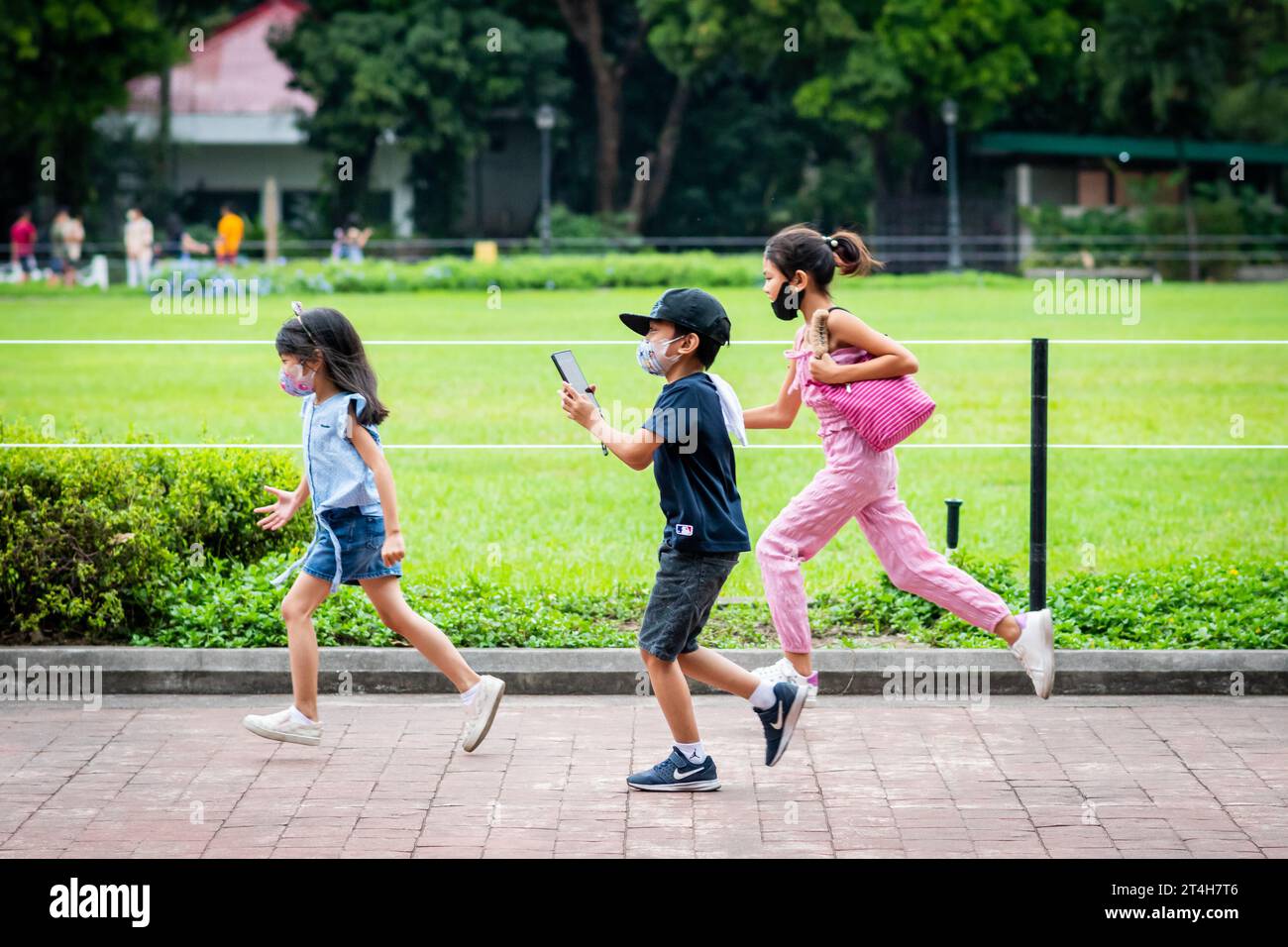 Children at play running through Rizal Park, Ermita, Manila, The ...