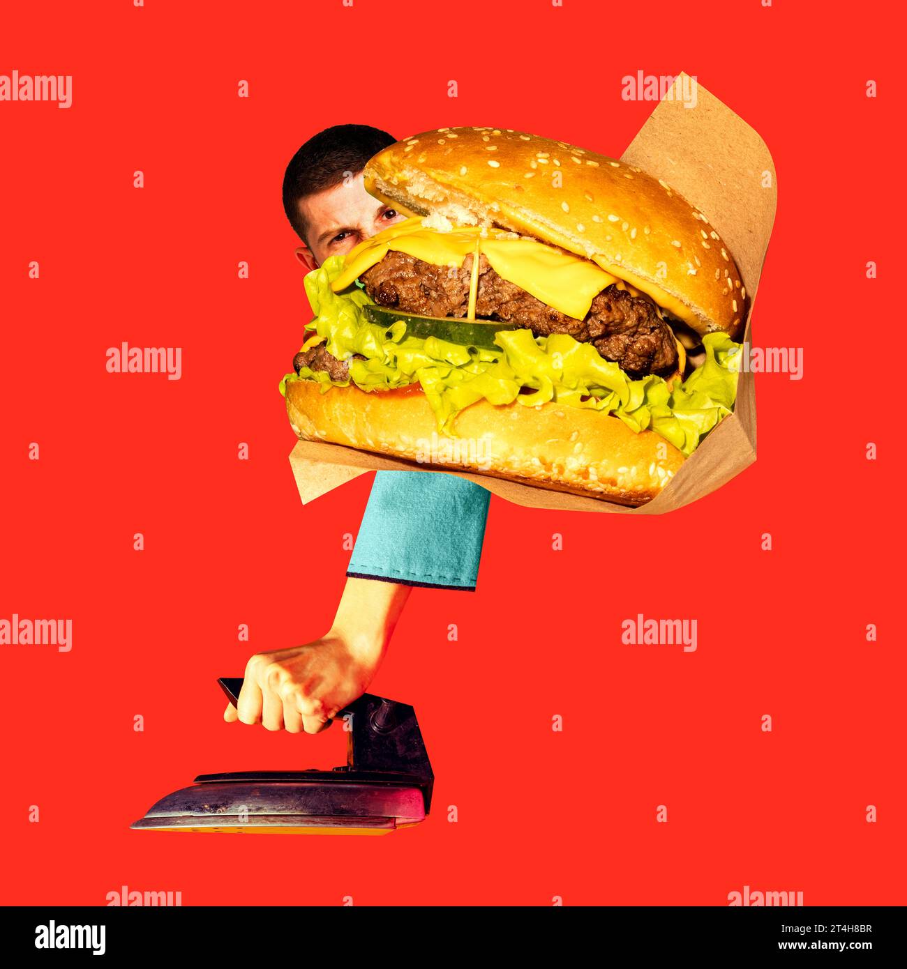 Young emotional man hiding behind big burger with chicken meat over red ...