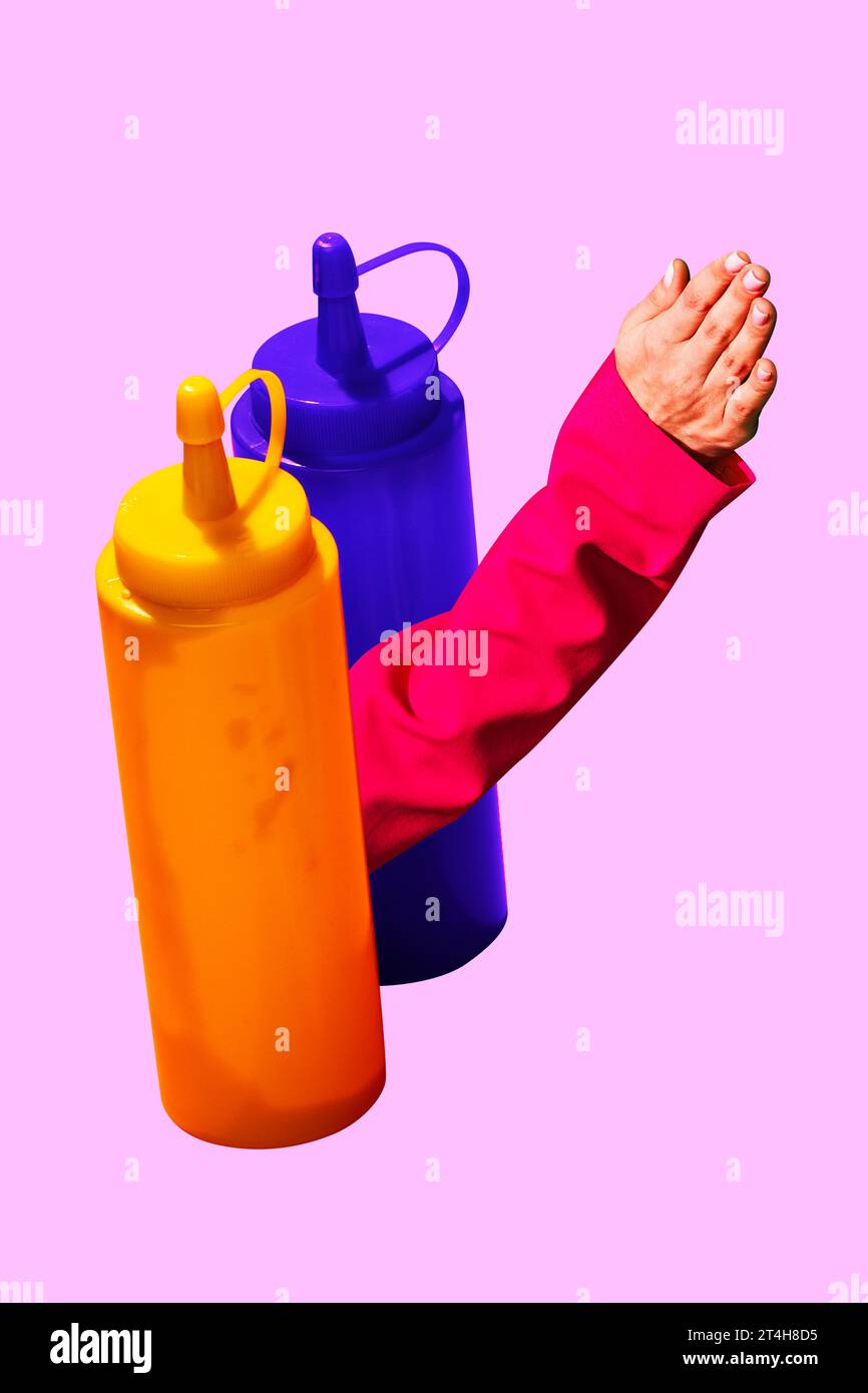 Female hand picking out two bottles with sauces. Mustard, ketchup ...