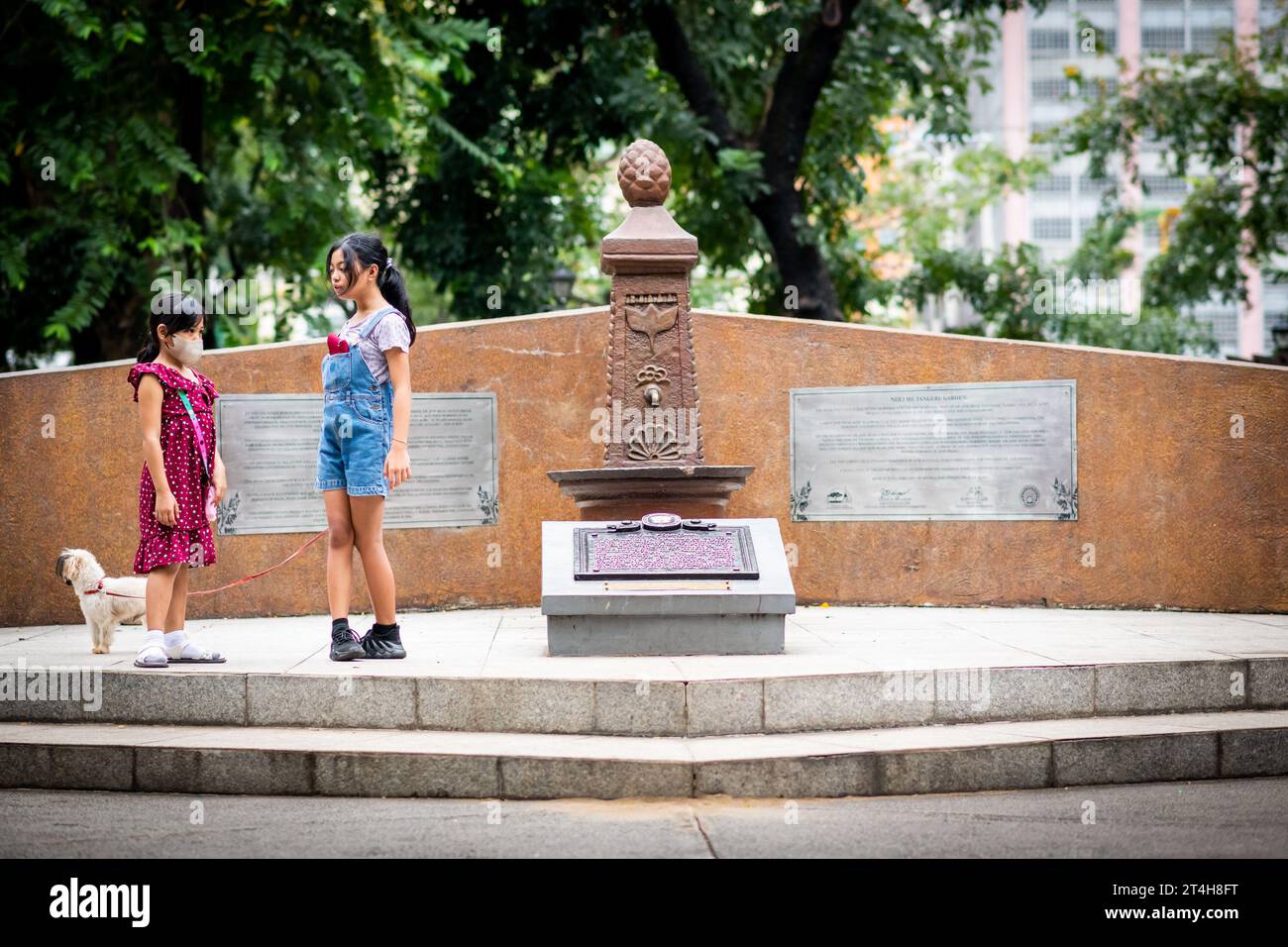 Children at play around a statue in Rizal Park, Ermita, Manila, The ...