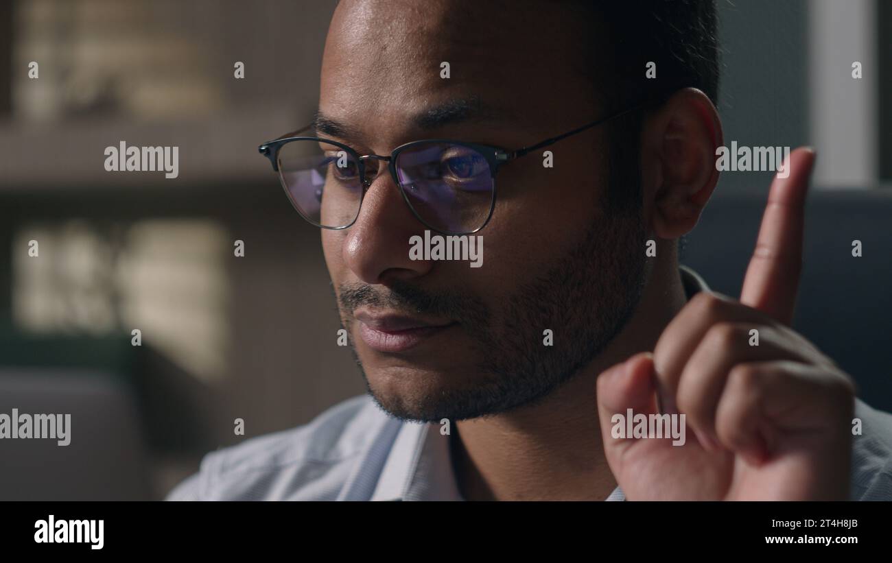Close up Indian man in glasses Arabian businessman with laptop thinking ...
