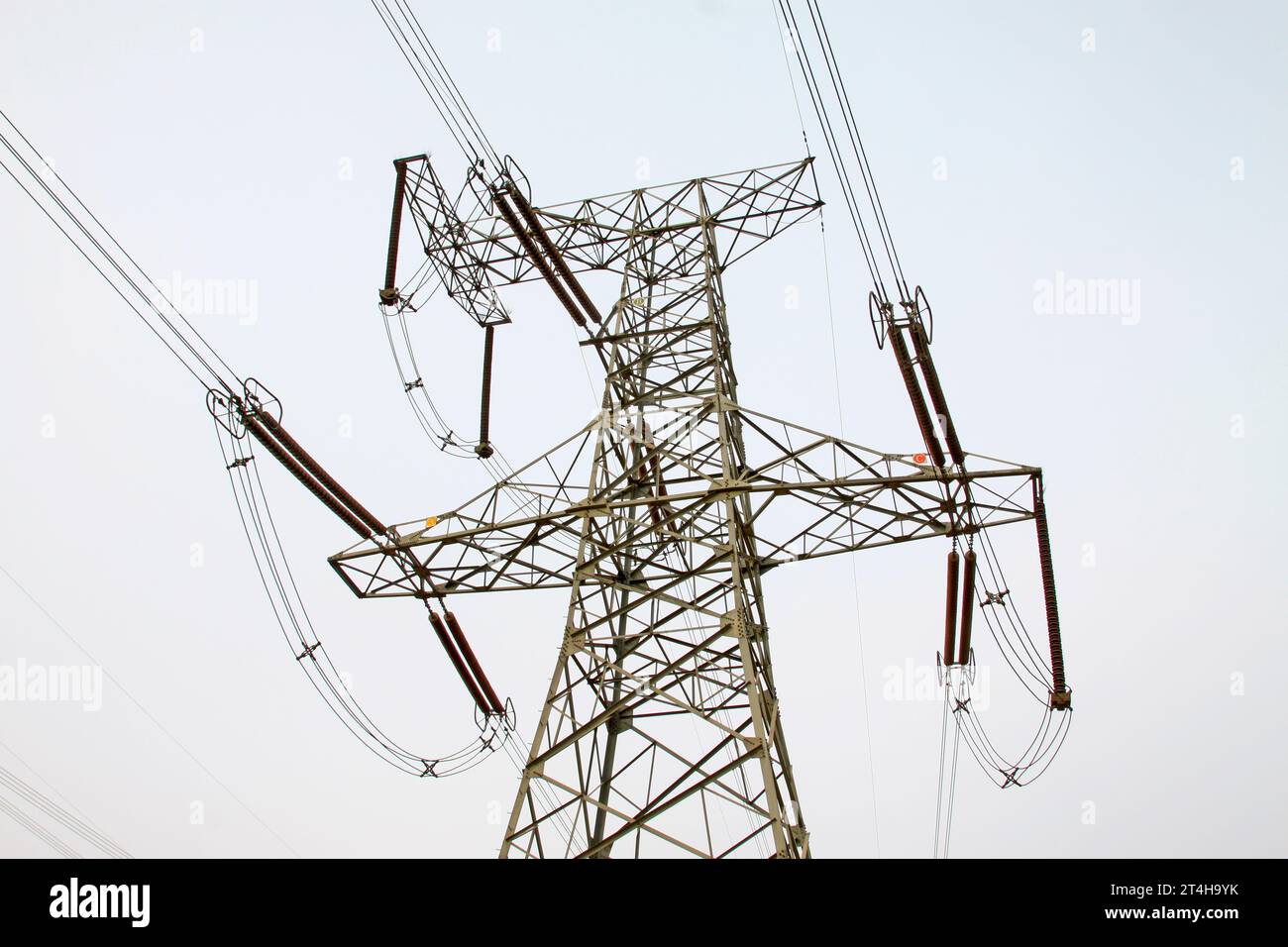 Electricity tower in the sky, closeup of photo Stock Photo - Alamy