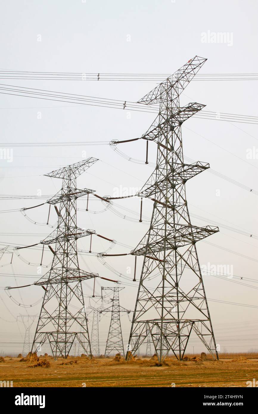 Electrical towers and power lines, closeup of photo Stock Photo - Alamy