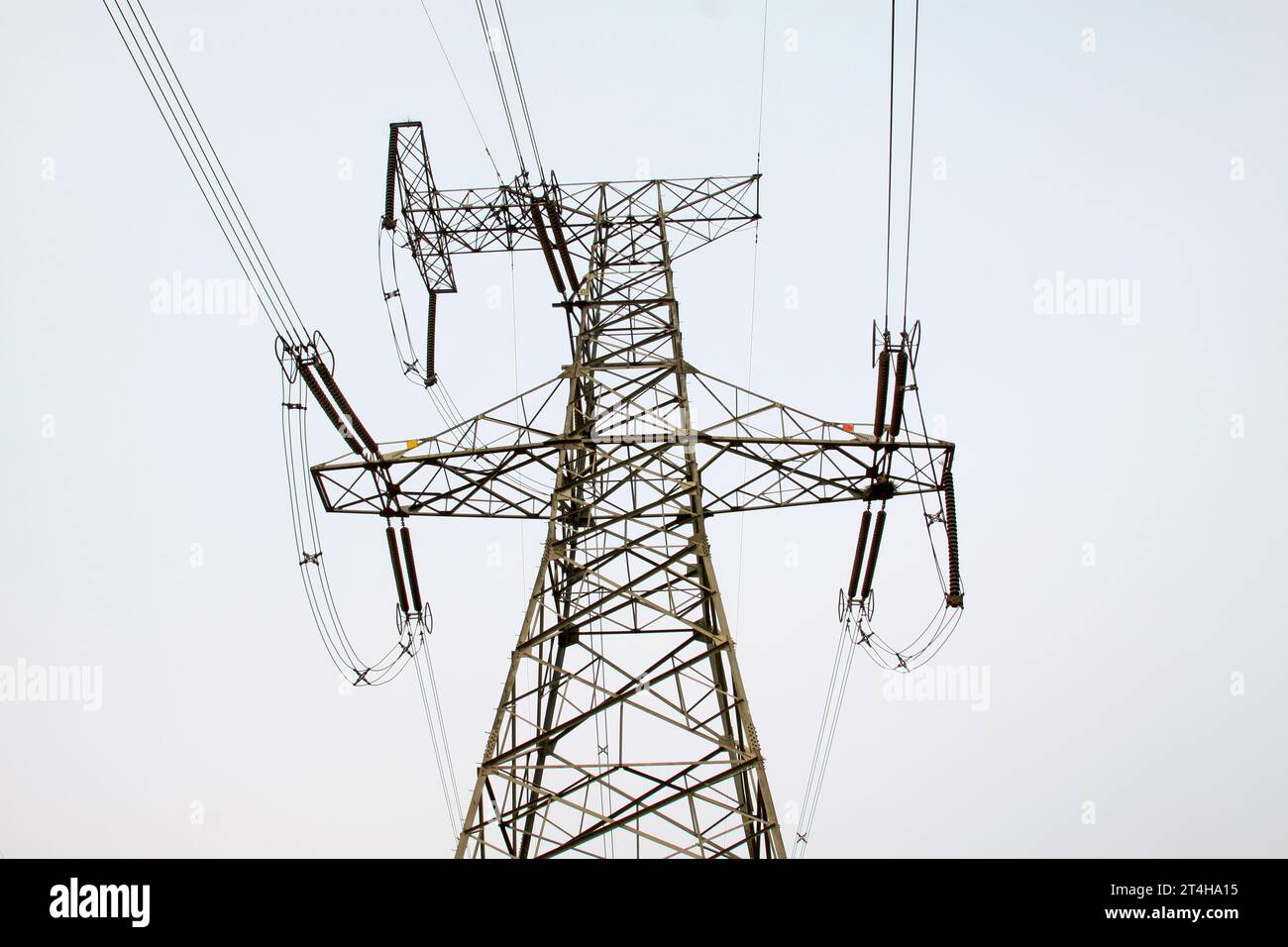 Electricity tower in the sky, closeup of photo Stock Photo - Alamy