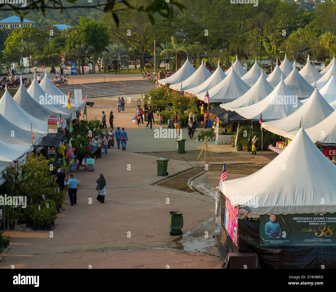 Putrajaya, Malaysia - Aug 10, 2022 White tents with people walking to ...