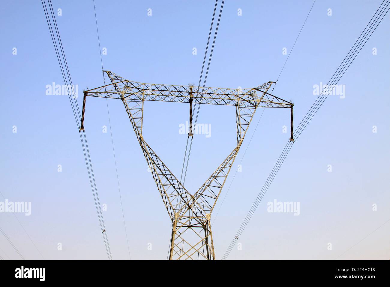 Electric power tower under the blue sky, closeup of photo Stock Photo ...