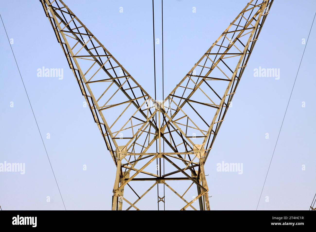 Electric power tower under the blue sky, closeup of photo Stock Photo ...