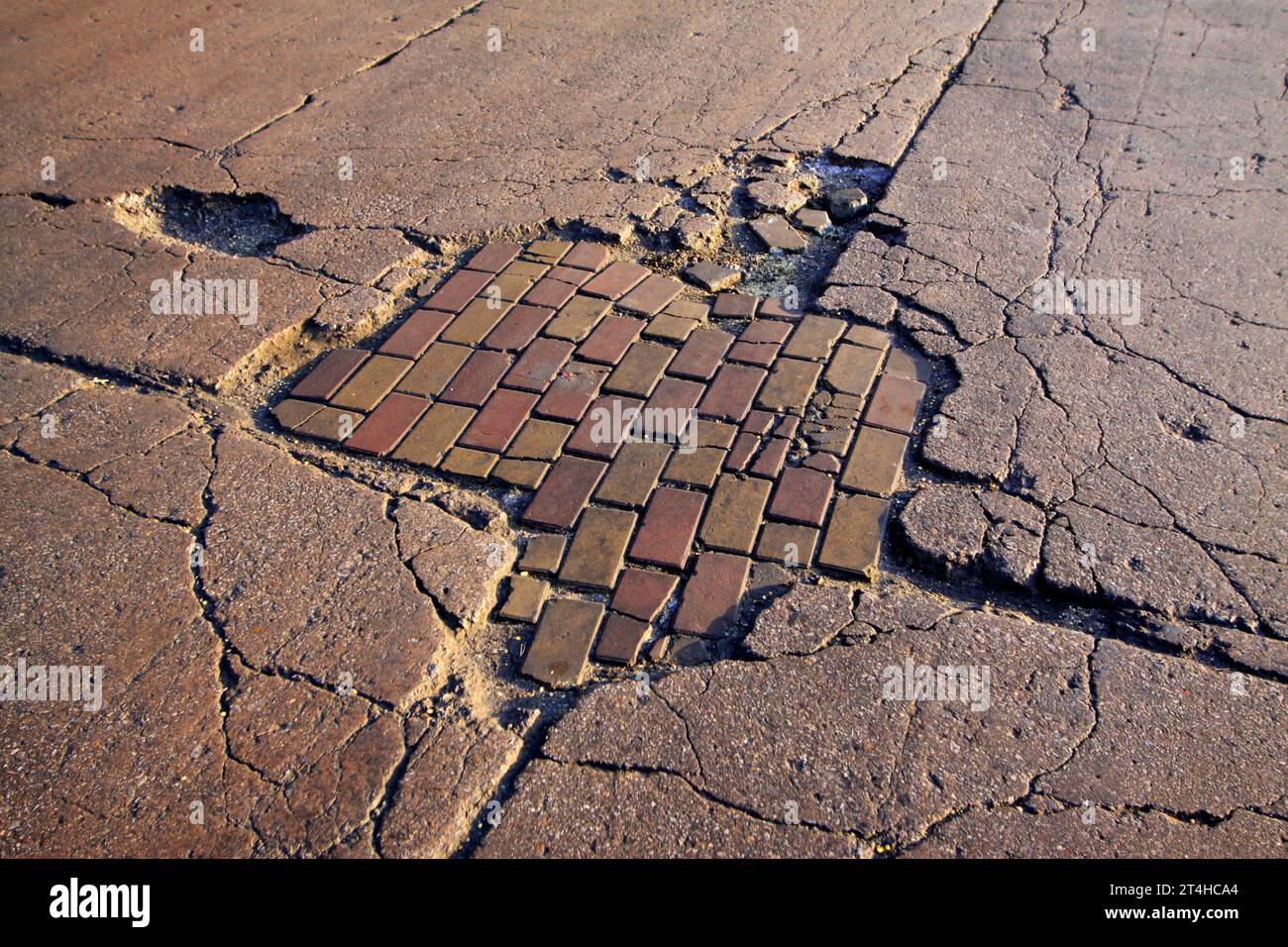broken asphalt pavement, closeup of photo Stock Photo - Alamy