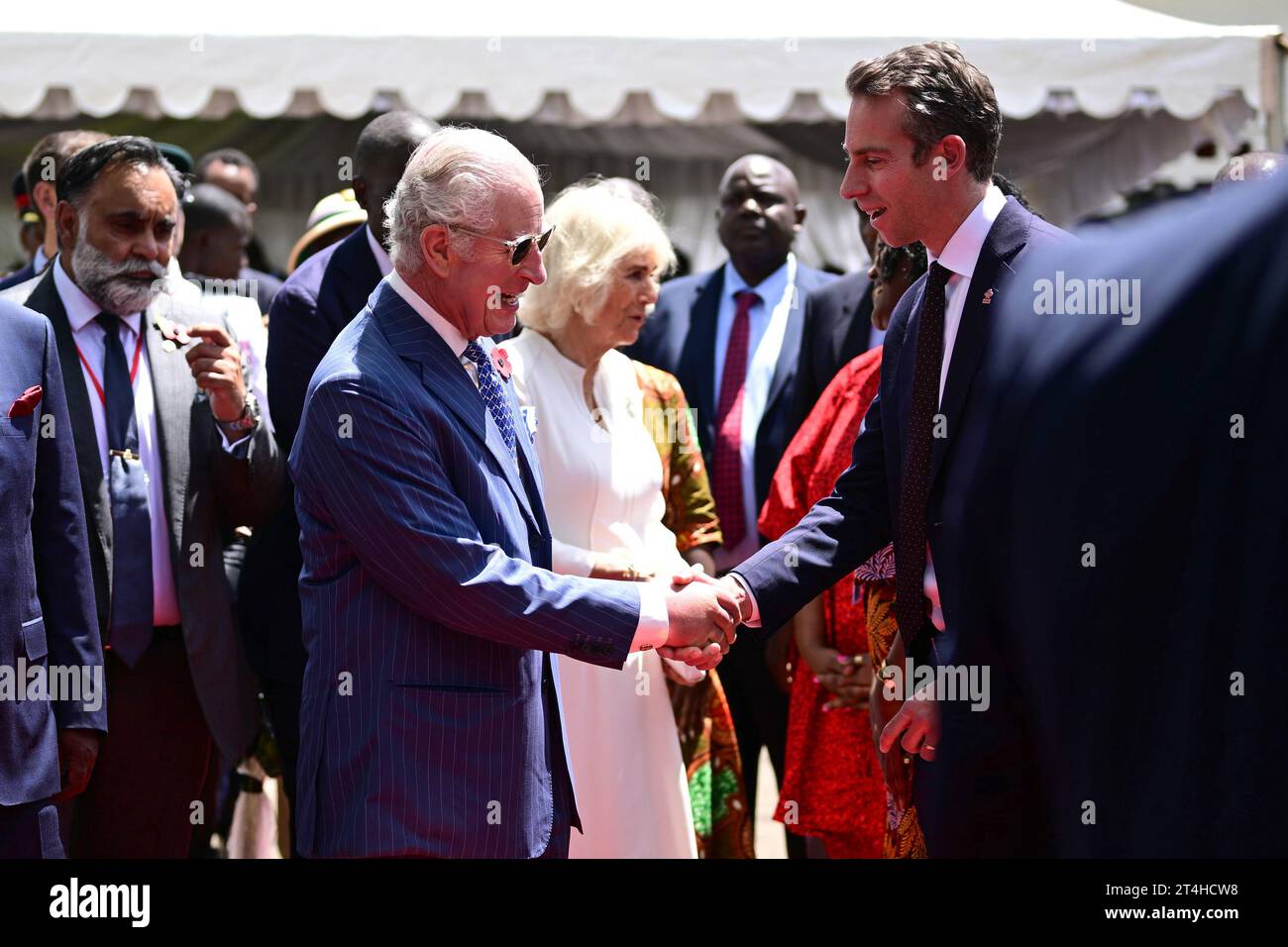 King Charles III (centre) shakes hands with Will Straw (right), CEO of ...