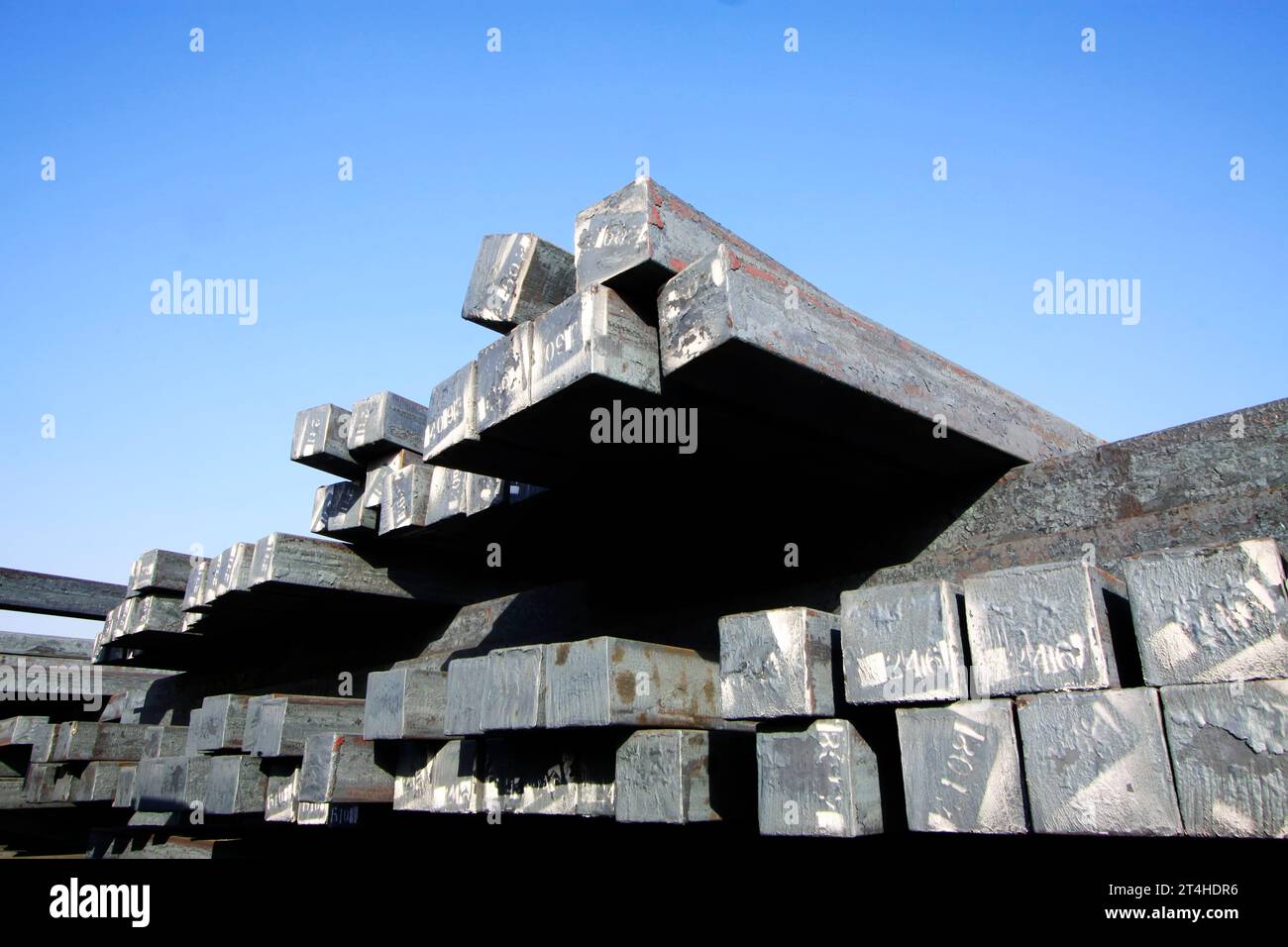 Steel ingot under the blue sky, closeup of photo Stock Photo - Alamy