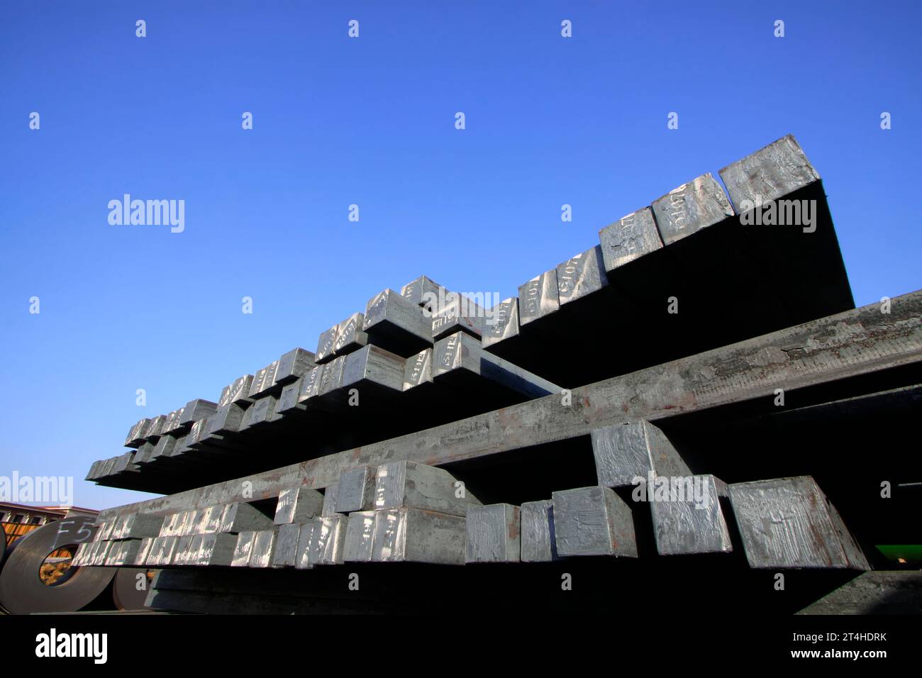 Steel ingot under the blue sky, closeup of photo Stock Photo - Alamy
