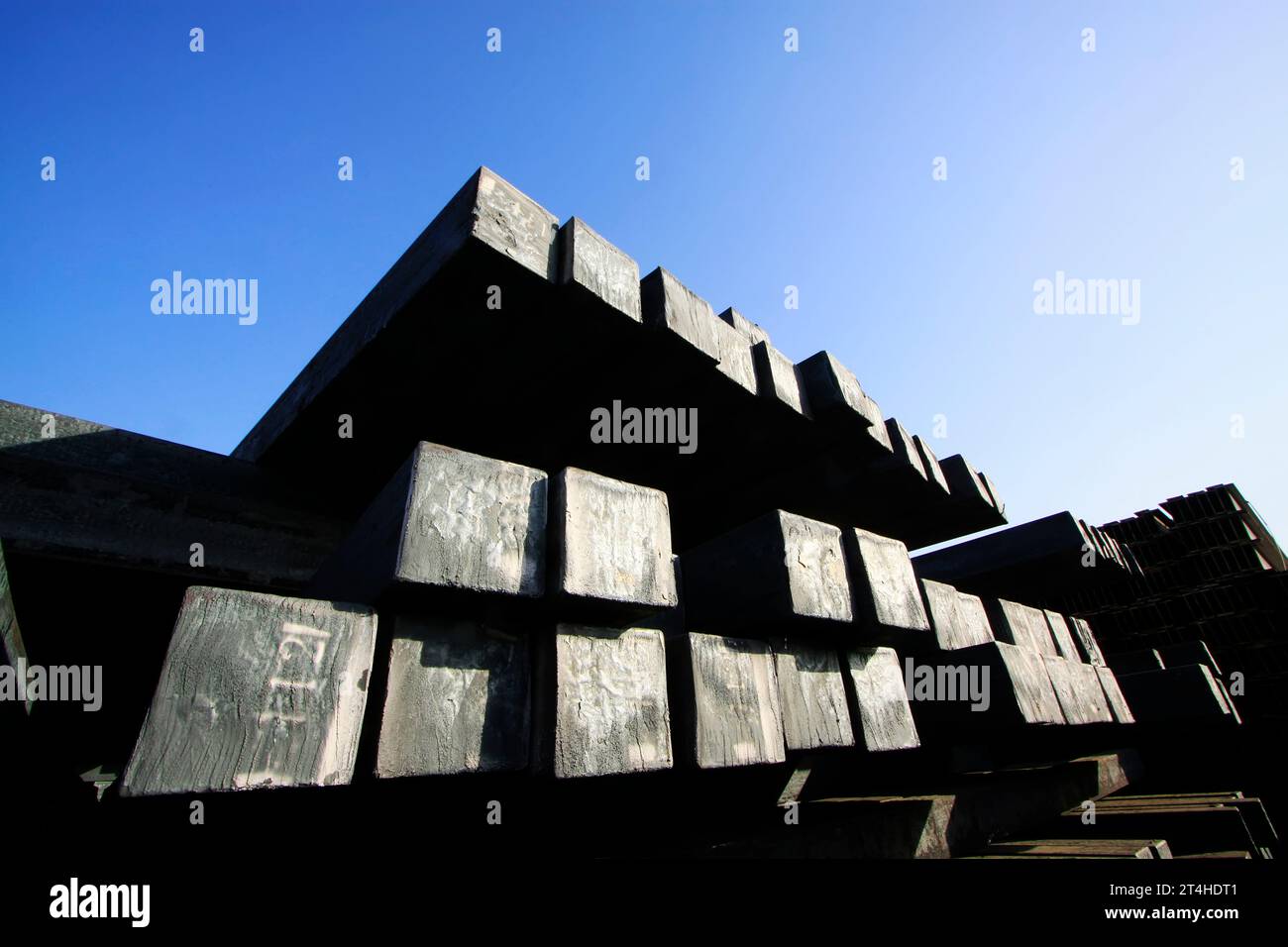Steel ingot under the blue sky, closeup of photo Stock Photo - Alamy