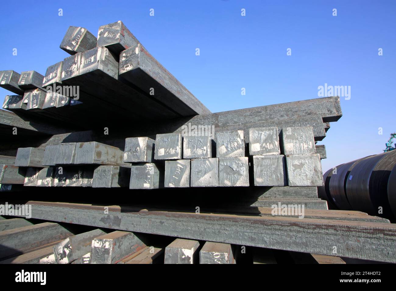 Steel ingot under the blue sky, closeup of photo Stock Photo - Alamy