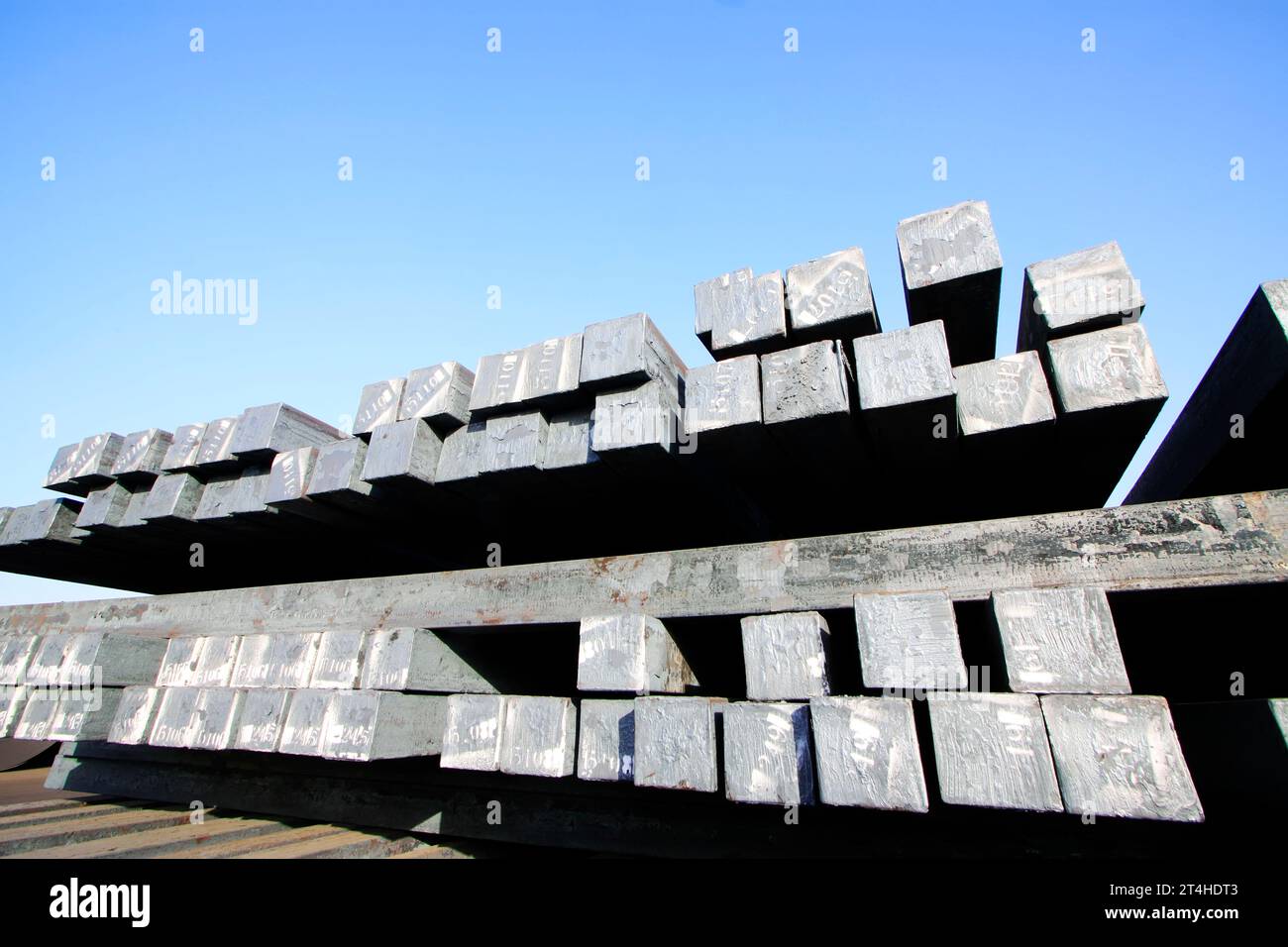 Steel ingot under the blue sky, closeup of photo Stock Photo - Alamy