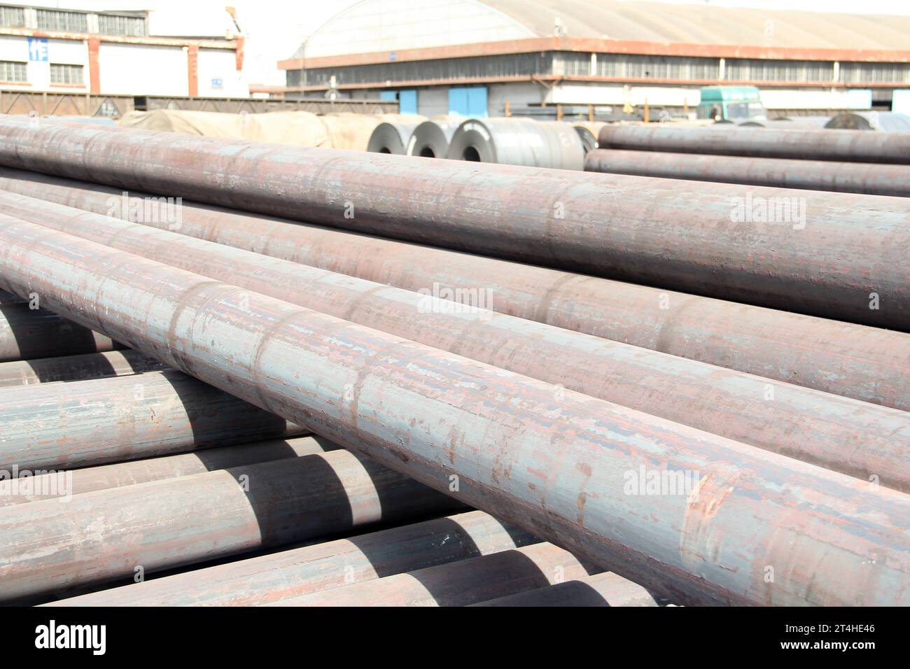 Steel pipe and warehouse, closeup of photo Stock Photo - Alamy