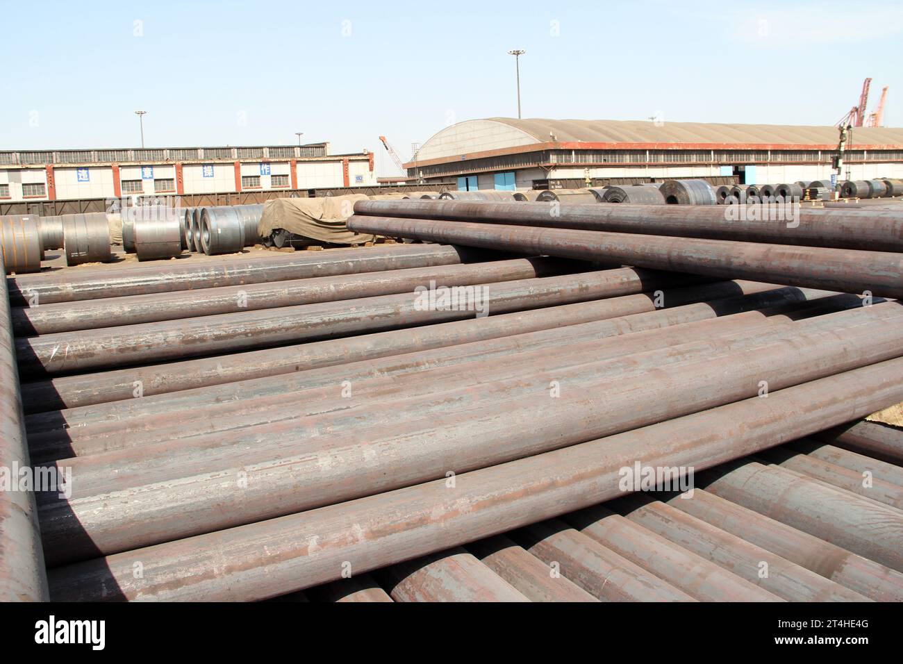 Steel pipe and warehouse, closeup of photo Stock Photo - Alamy