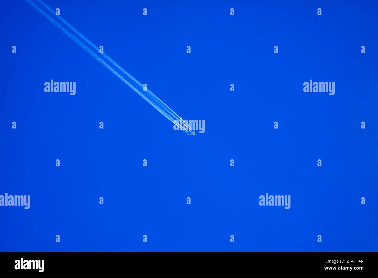 A jet plane in the blue sky background, closeup of photo Stock Photo ...