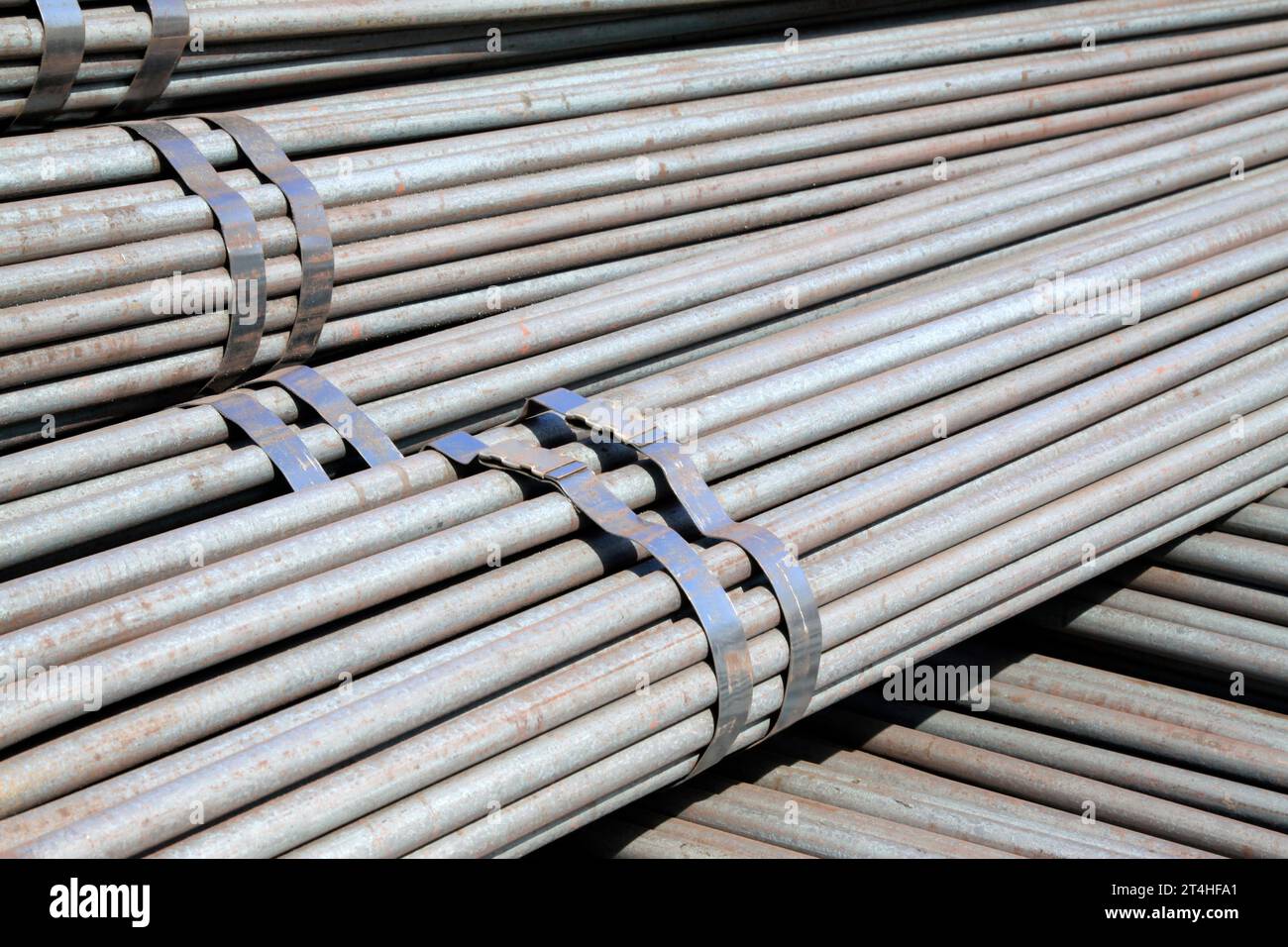 Round bar steel pile up together, closeup of photo Stock Photo - Alamy