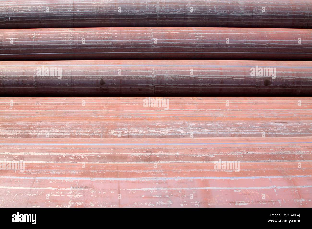 Piles of steel pipe, closeup of photo Stock Photo - Alamy