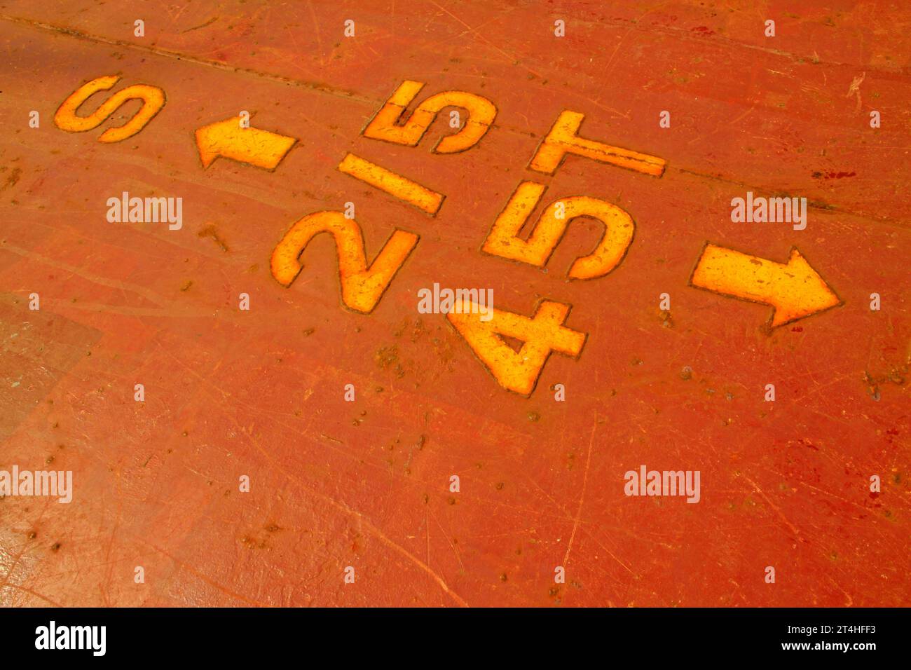 Numbers and lines in yellow brown sheet metal, closeup of photo Stock ...