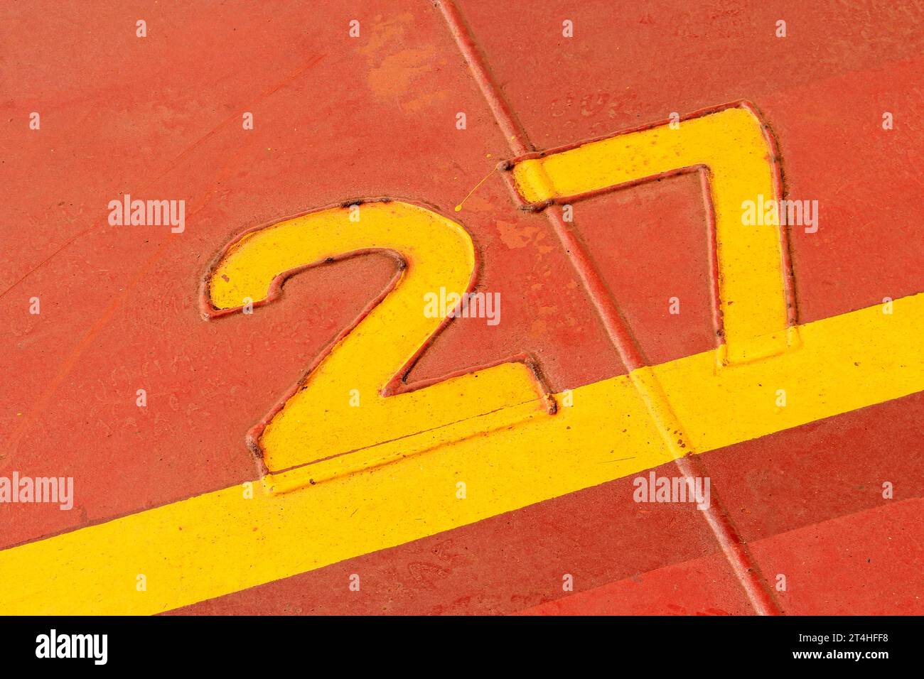 Numbers and lines in yellow brown sheet metal, closeup of photo Stock ...