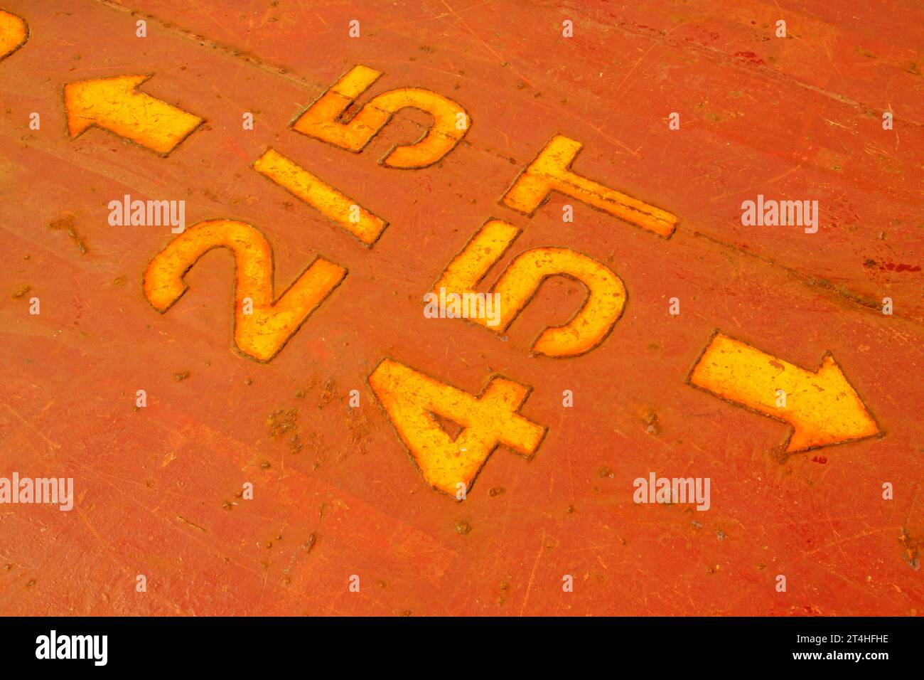Numbers and lines in yellow brown sheet metal, closeup of photo Stock ...