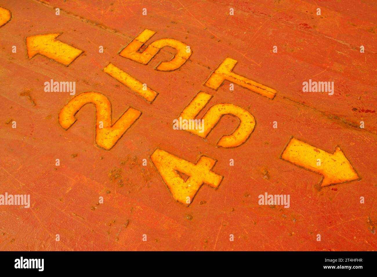 Numbers and lines in yellow brown sheet metal, closeup of photo Stock ...