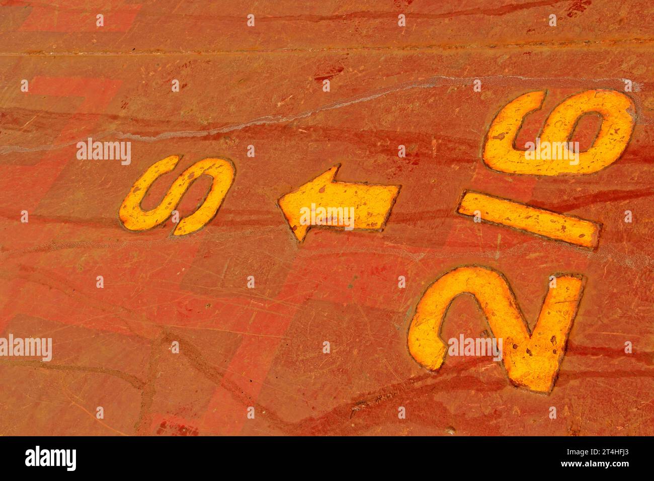 Numbers and lines in yellow brown sheet metal, closeup of photo Stock ...