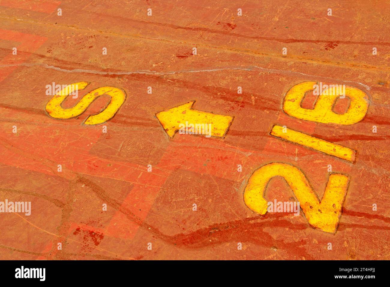 Numbers and lines in yellow brown sheet metal, closeup of photo Stock ...