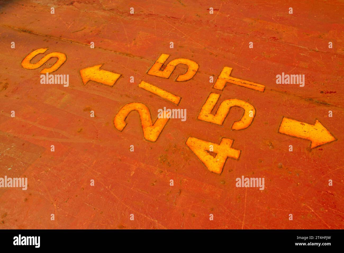 Numbers and lines in yellow brown sheet metal, closeup of photo Stock ...