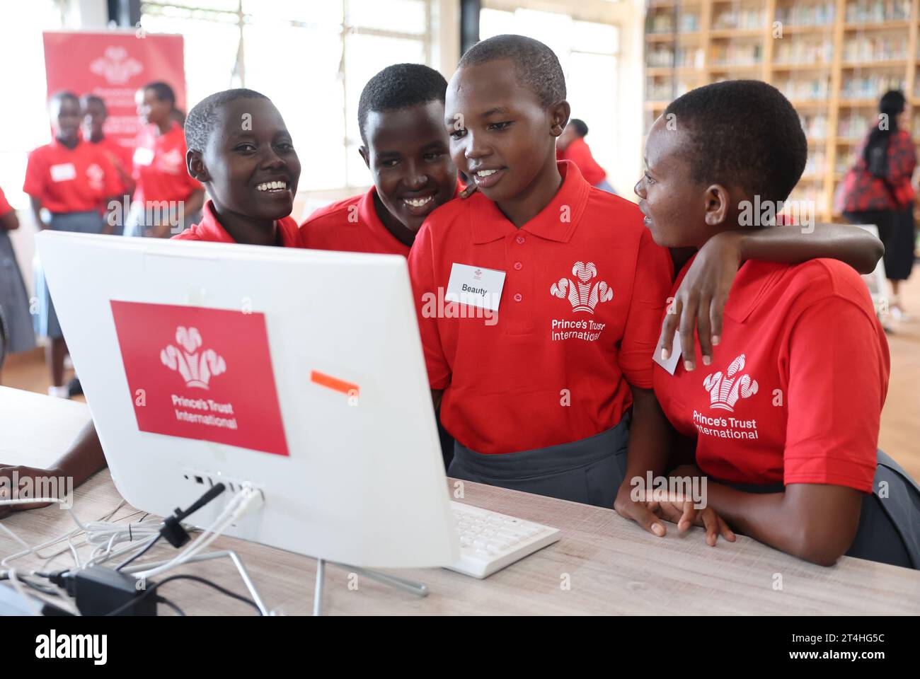 Young students look at a computer monitor ahead of the arrival of King ...