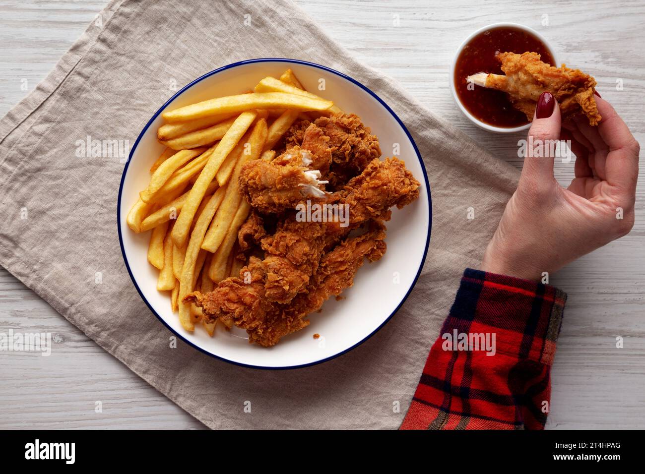 Female hand takes crispy golden hi-res stock photography and images - Alamy