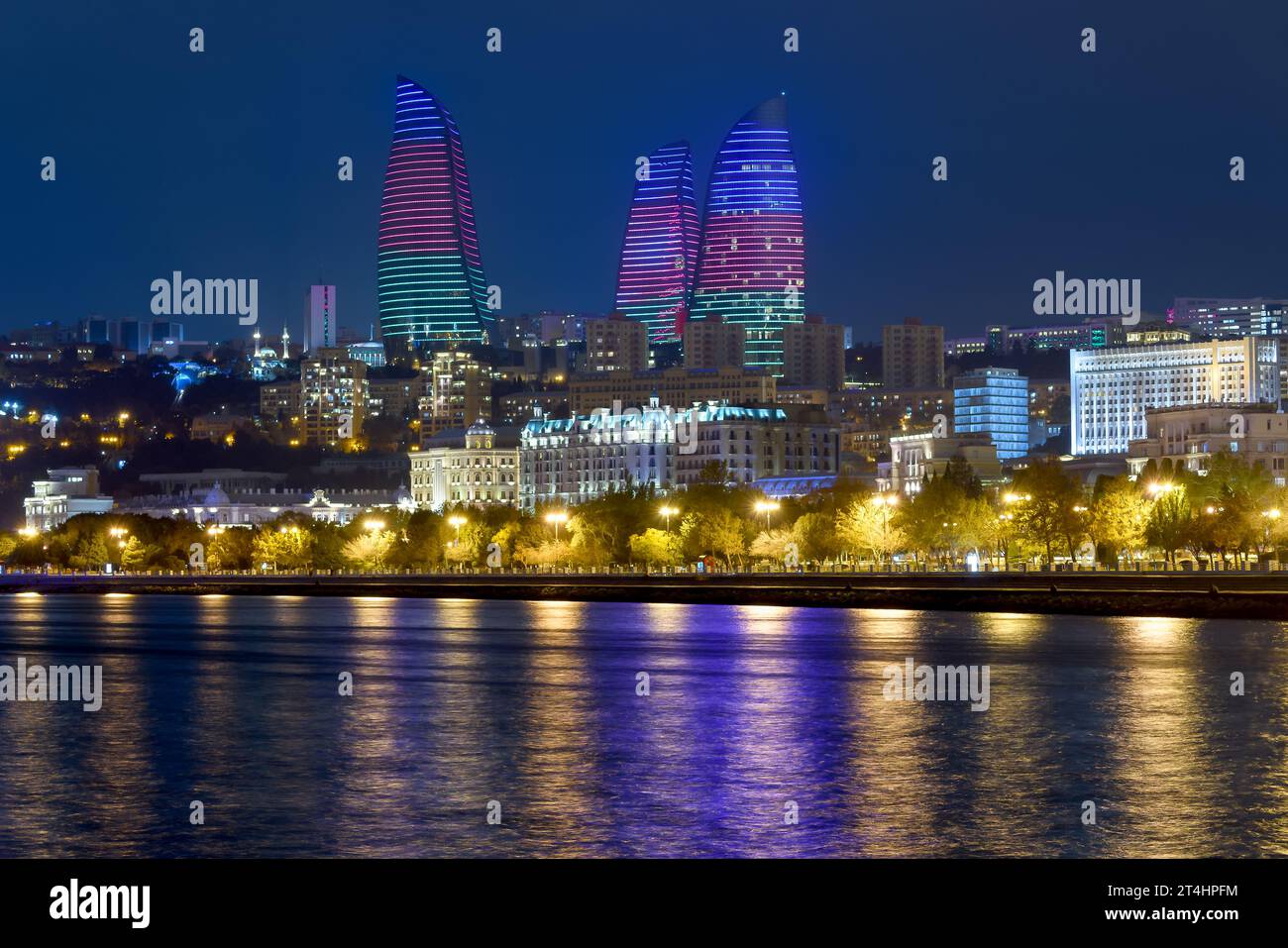 Flame Towers at night in Baku, Azerbaijan. Modern buildings illuminated ...