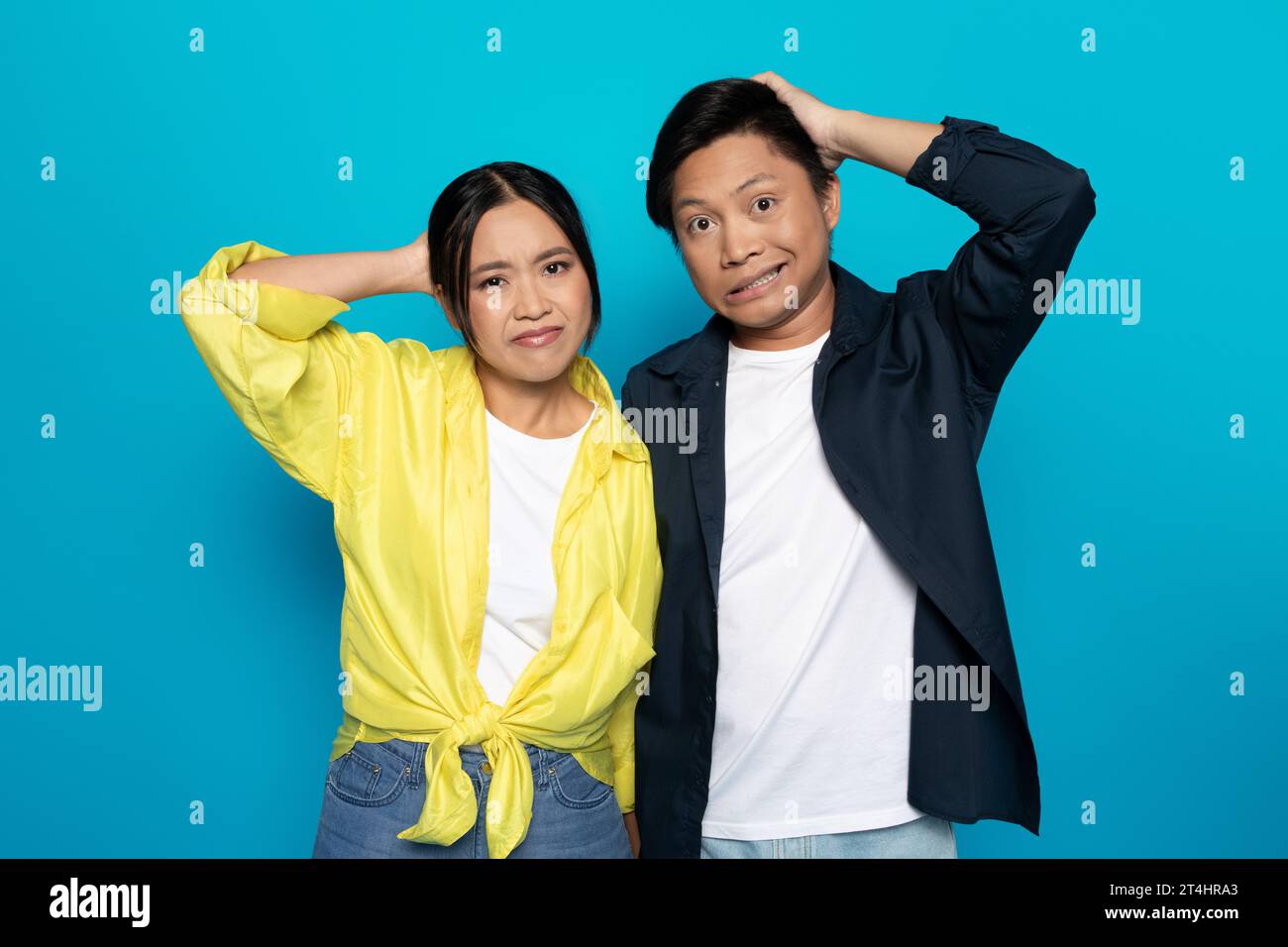 Pensive confused korean millennial couple in casual scratching heads ...