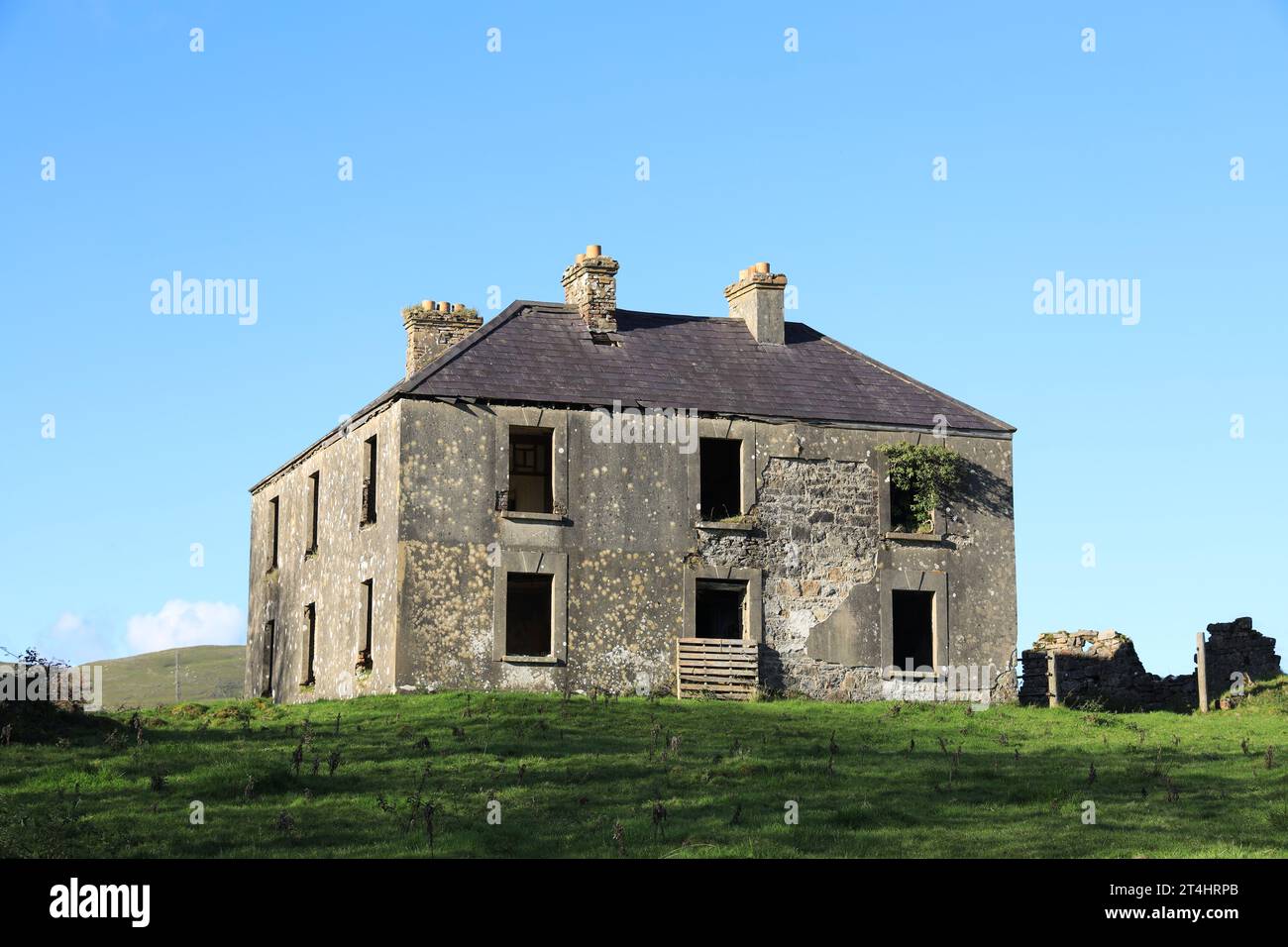 Derelict two storey house in countryside in rural County Leitrim ...