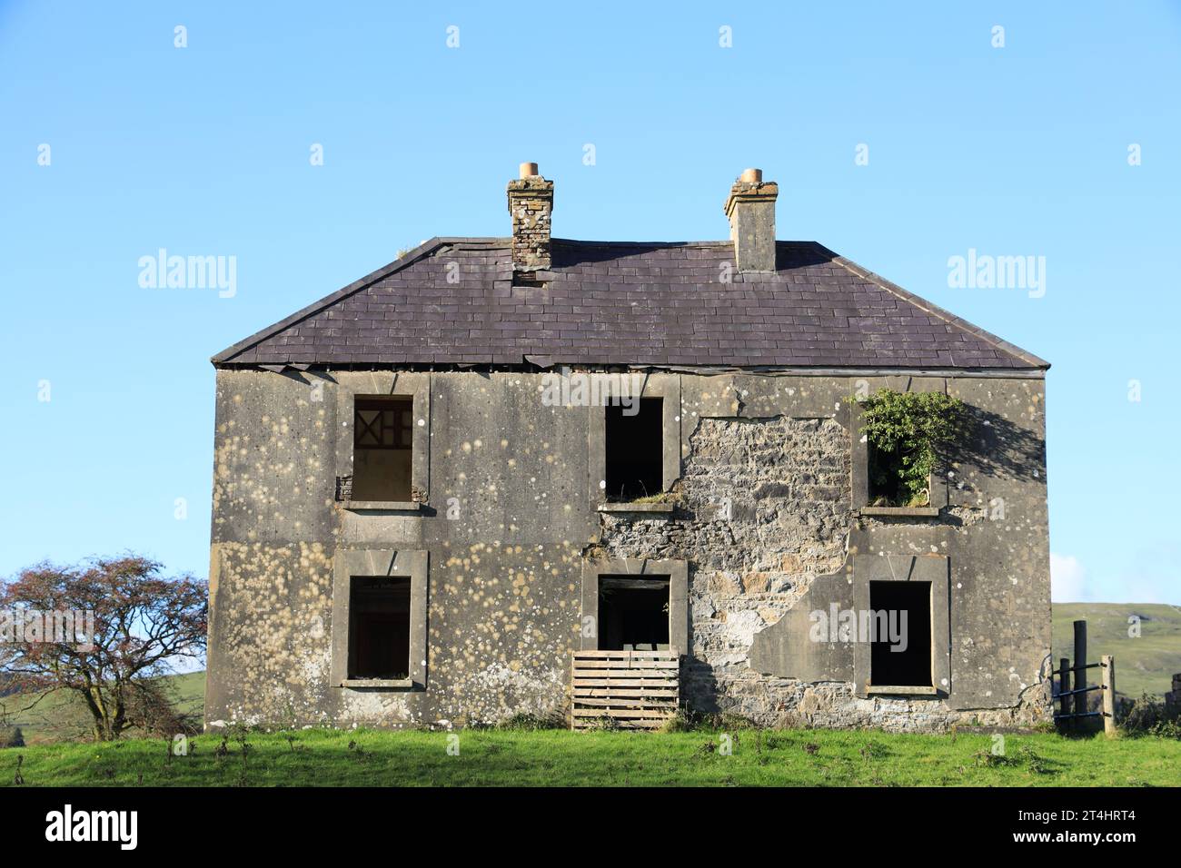 Derelict two storey house in countryside in rural County Leitrim ...