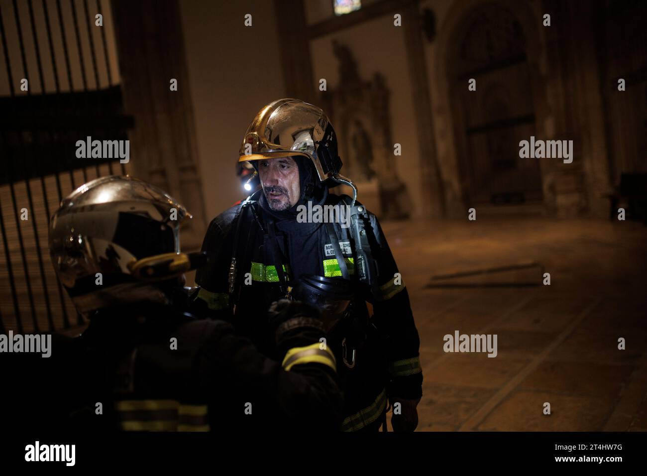 A firefighter during a fire drill at the Cathedral of Alcalá de Henares ...