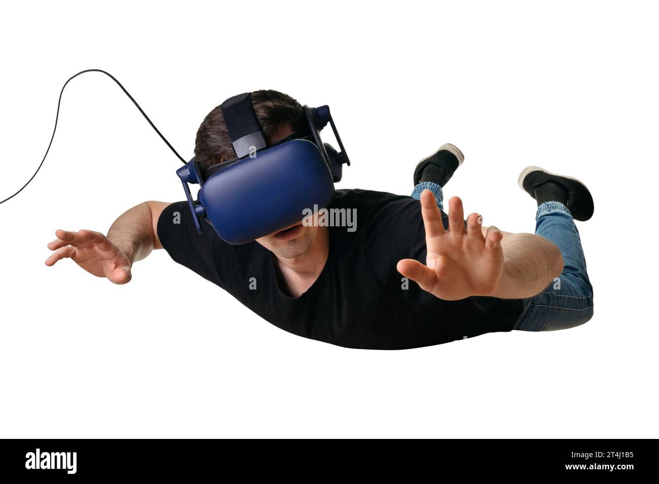 Young man flying in zero gravity space and experiencing virtual reality ...