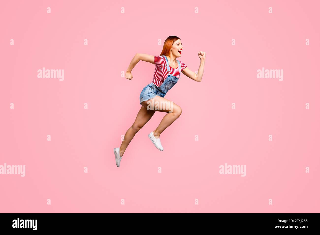 Full-size portrait of running marathon girl who looks in front of her ...