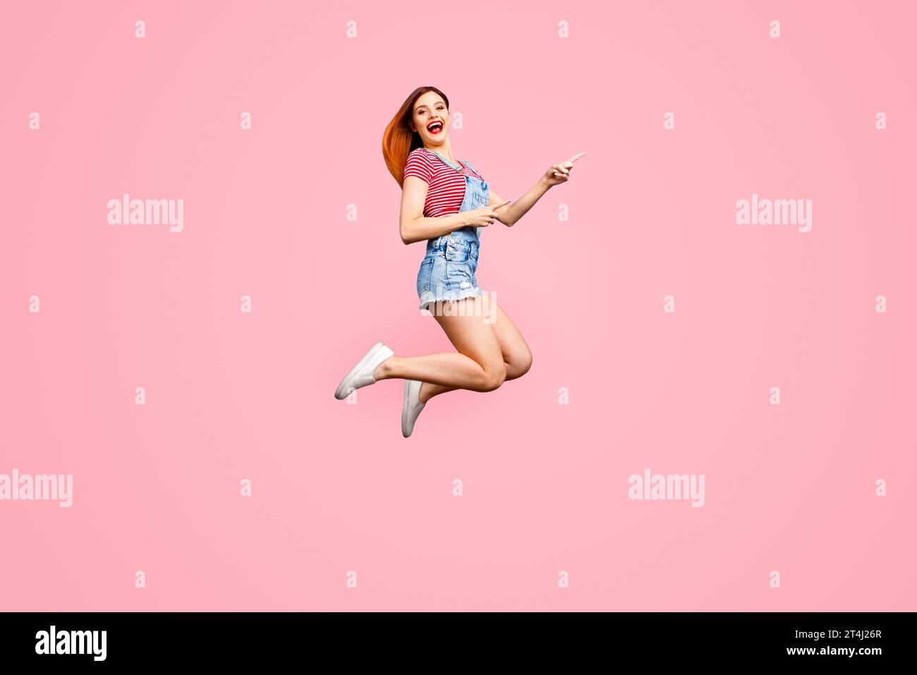 Full-size excited cheerful careless girl demonstrating empty place ...