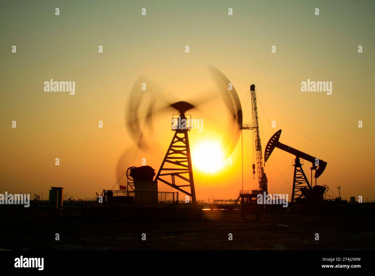 Crank balanced beam pumping unit in Jidong oilfield sunset scenery ...