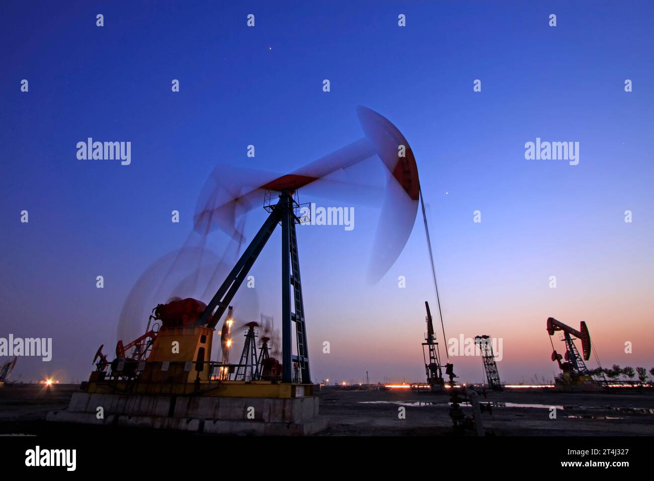 Crank balanced beam pumping unit in Jidong oilfield sunset scenery ...