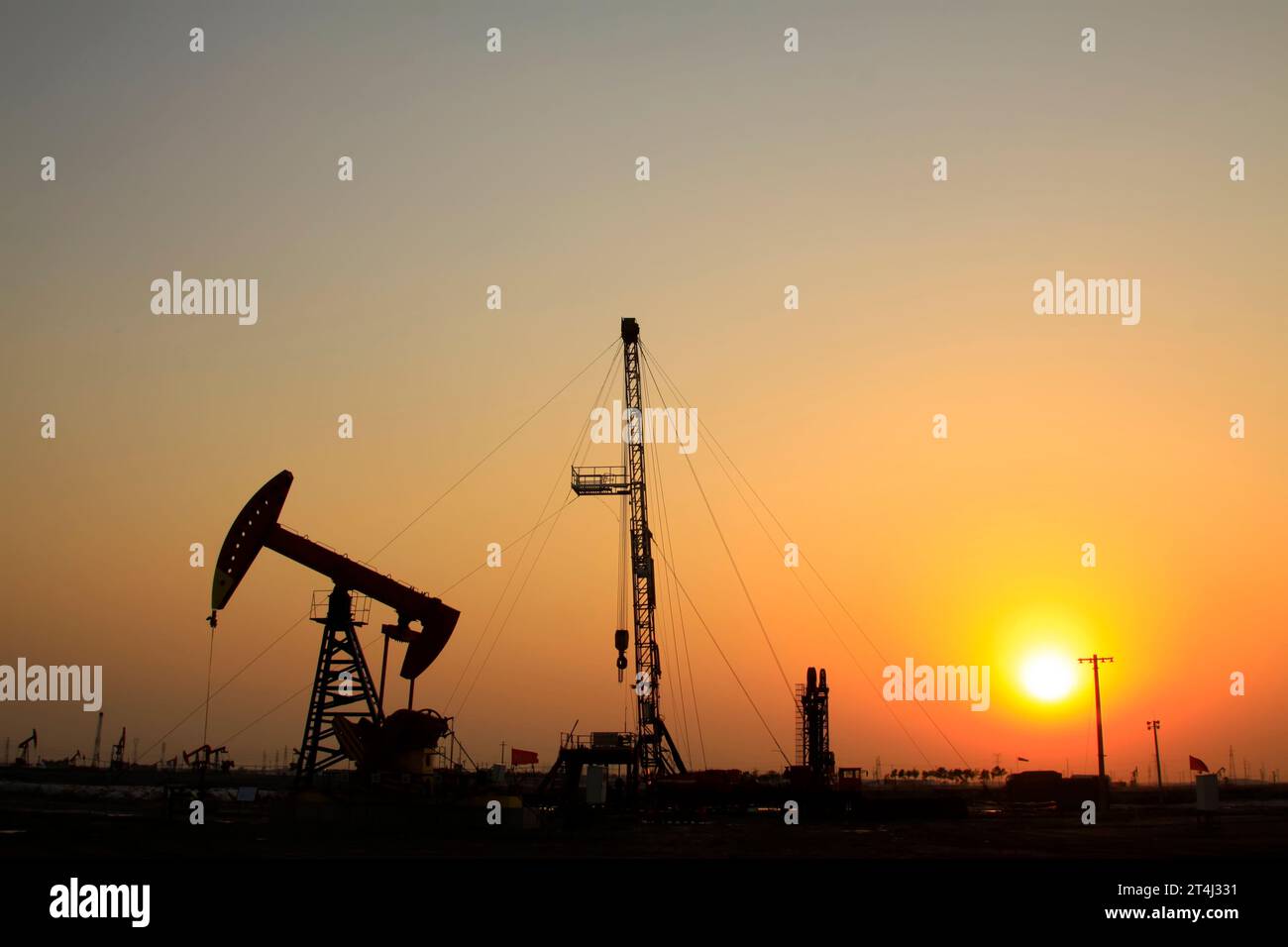 Crank balanced beam pumping unit in Jidong oilfield sunset scenery ...