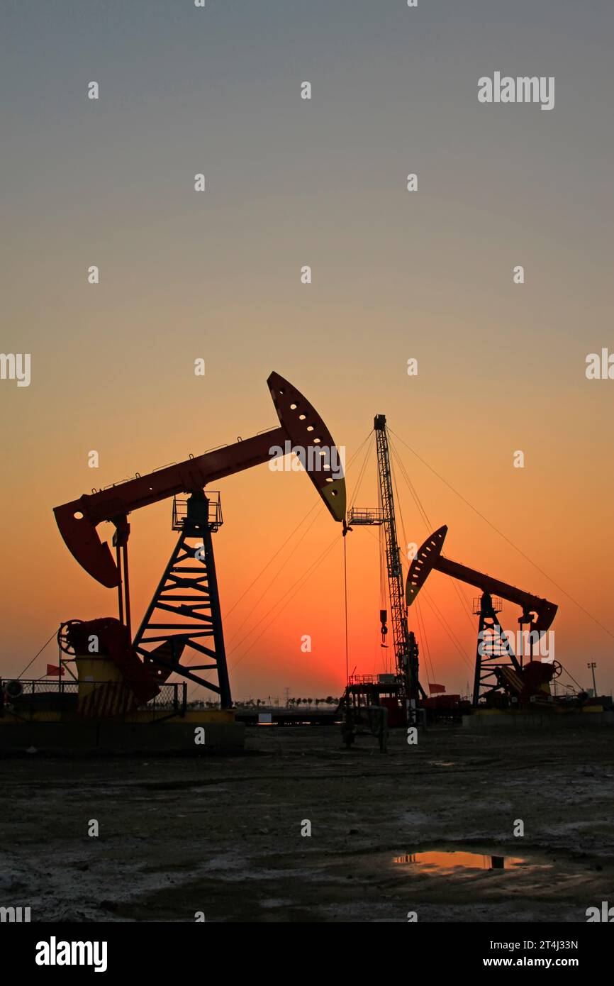 Crank balanced beam pumping unit in Jidong oilfield sunset scenery ...