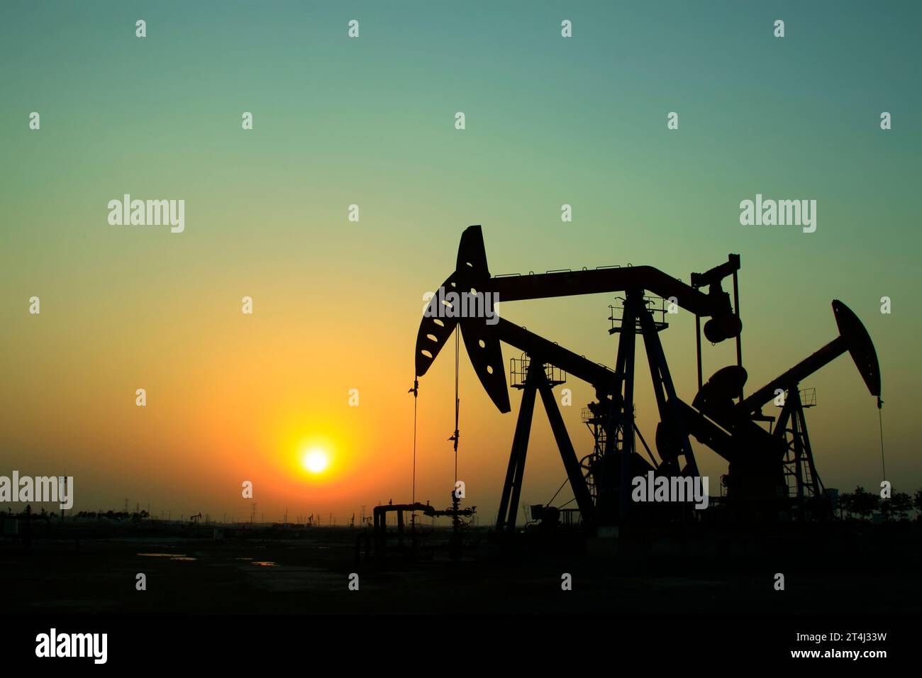 Crank balanced beam pumping unit in Jidong oilfield sunset scenery ...