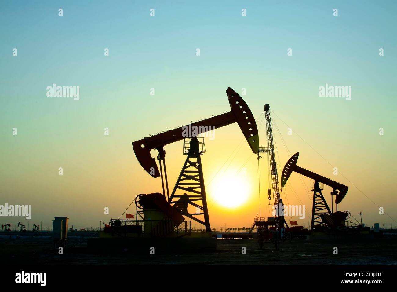 Crank balanced beam pumping unit in Jidong oilfield sunset scenery ...