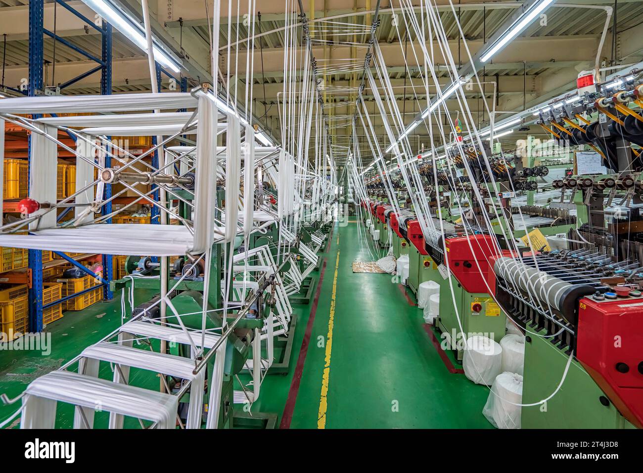 Elastic weaving workshop at textile factory in industrial zone in Ho ...