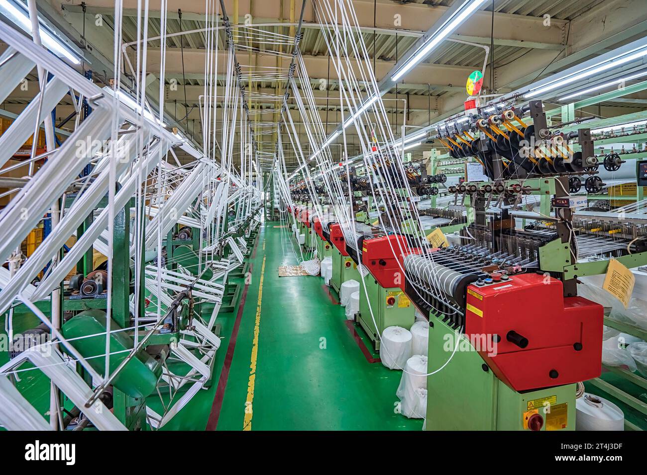 Elastic weaving workshop at textile factory in industrial zone in Ho ...
