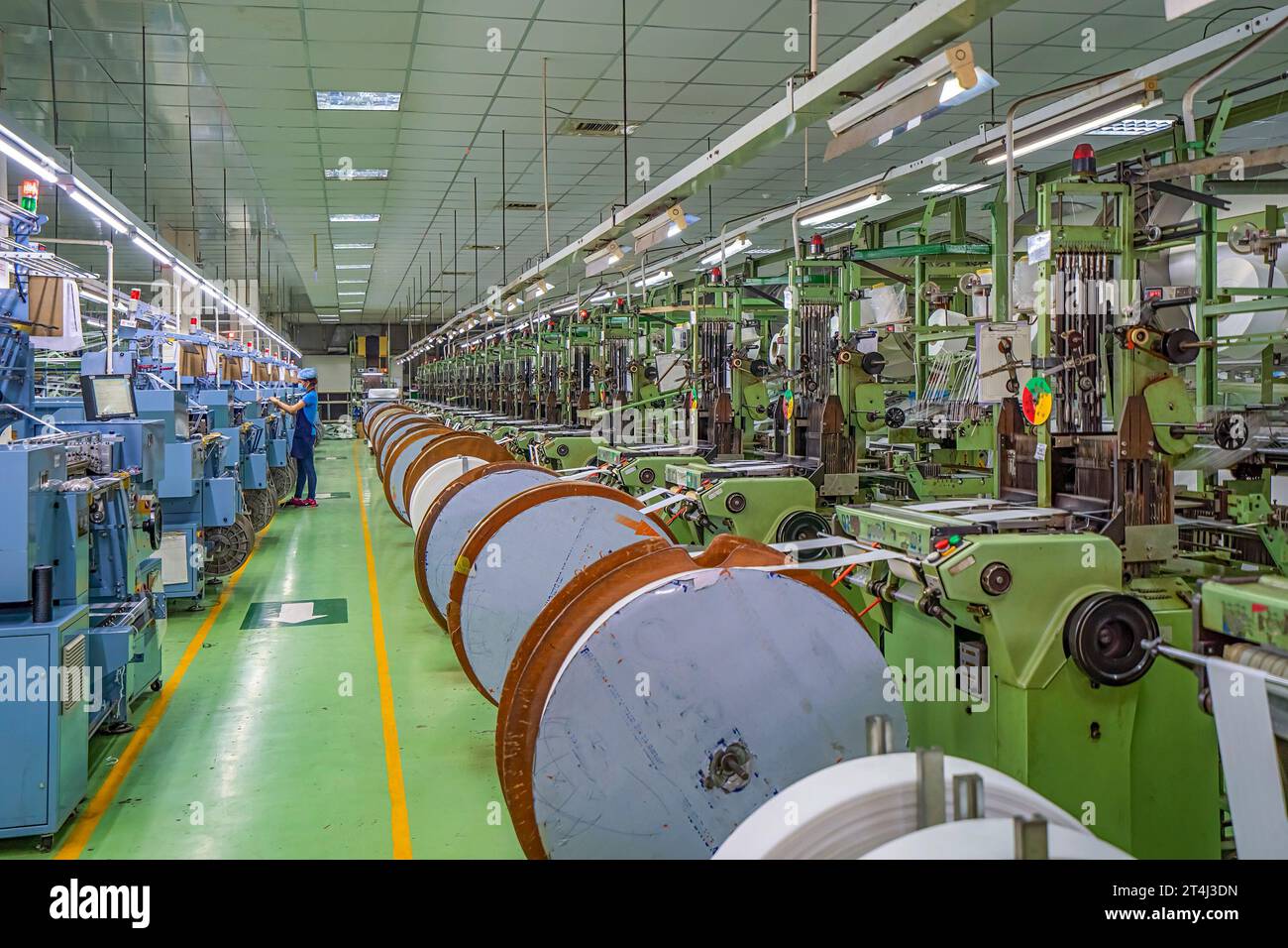 Elastic weaving workshop at textile factory in industrial zone in Ho ...